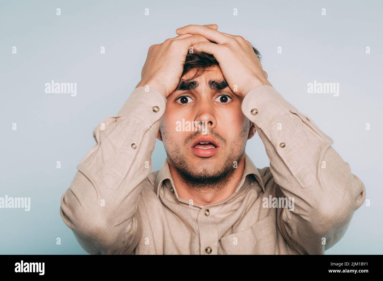 sad worried scared afraid man pull hair out emotion Stock Photo - Alamy