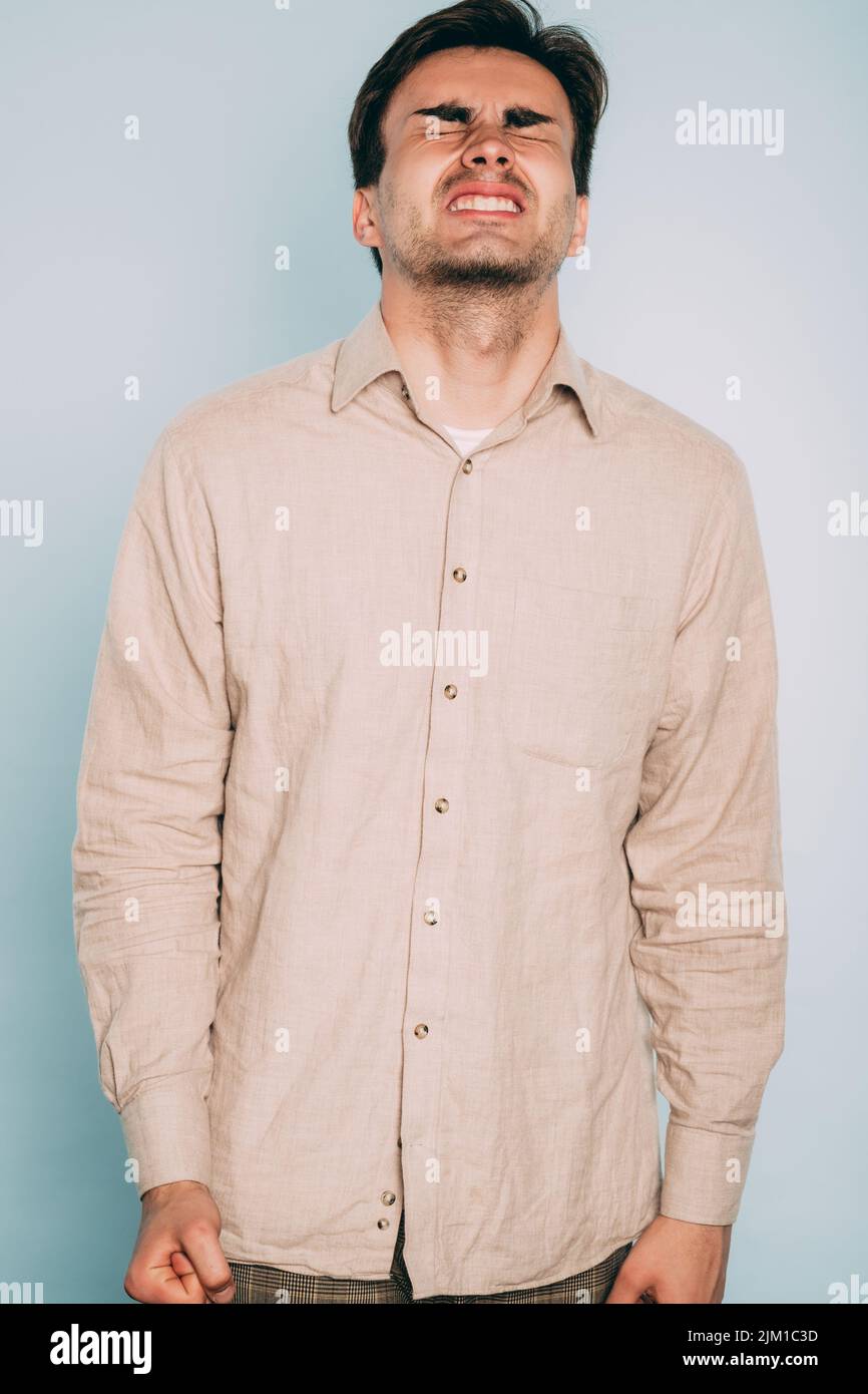 man face disturbed pain grimace suffering torture Stock Photo - Alamy