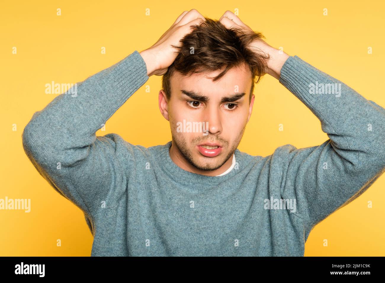 sad worried distraught man pull hair out emotion Stock Photo - Alamy