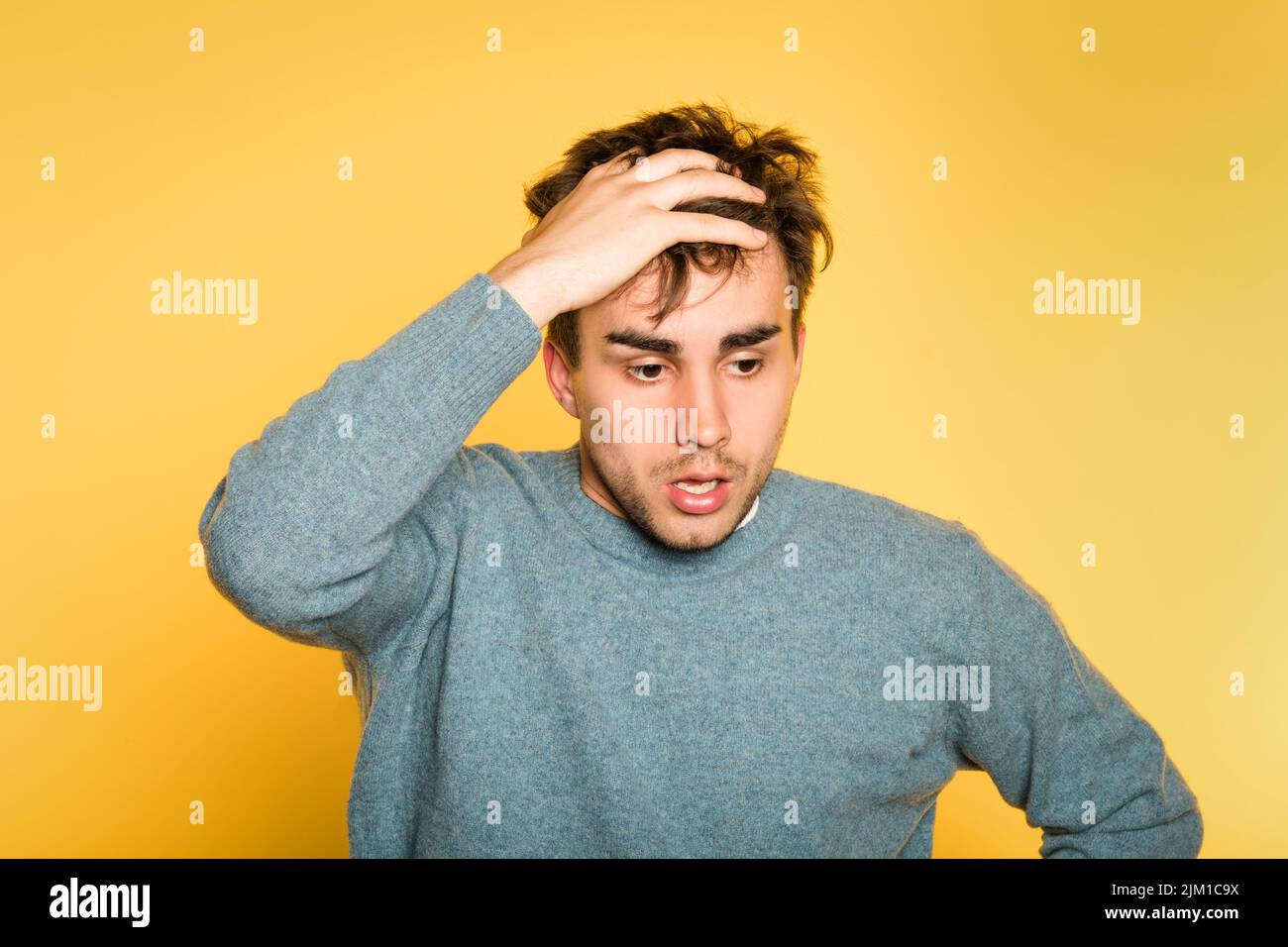 sad worried scared afraid man pull hair out emotion Stock Photo - Alamy