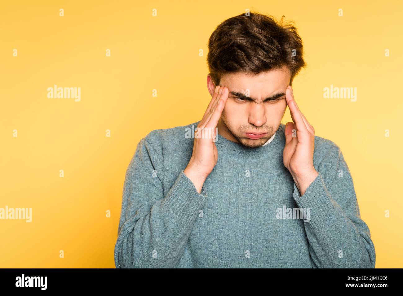 focused frowning man thinking blow mind emotion Stock Photo - Alamy