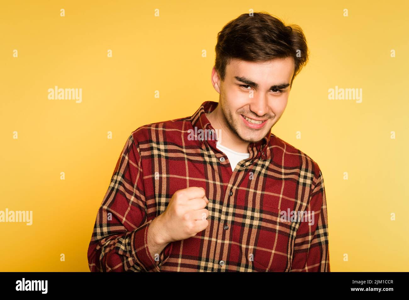 delighted man fist gesture success victory emotion Stock Photo - Alamy