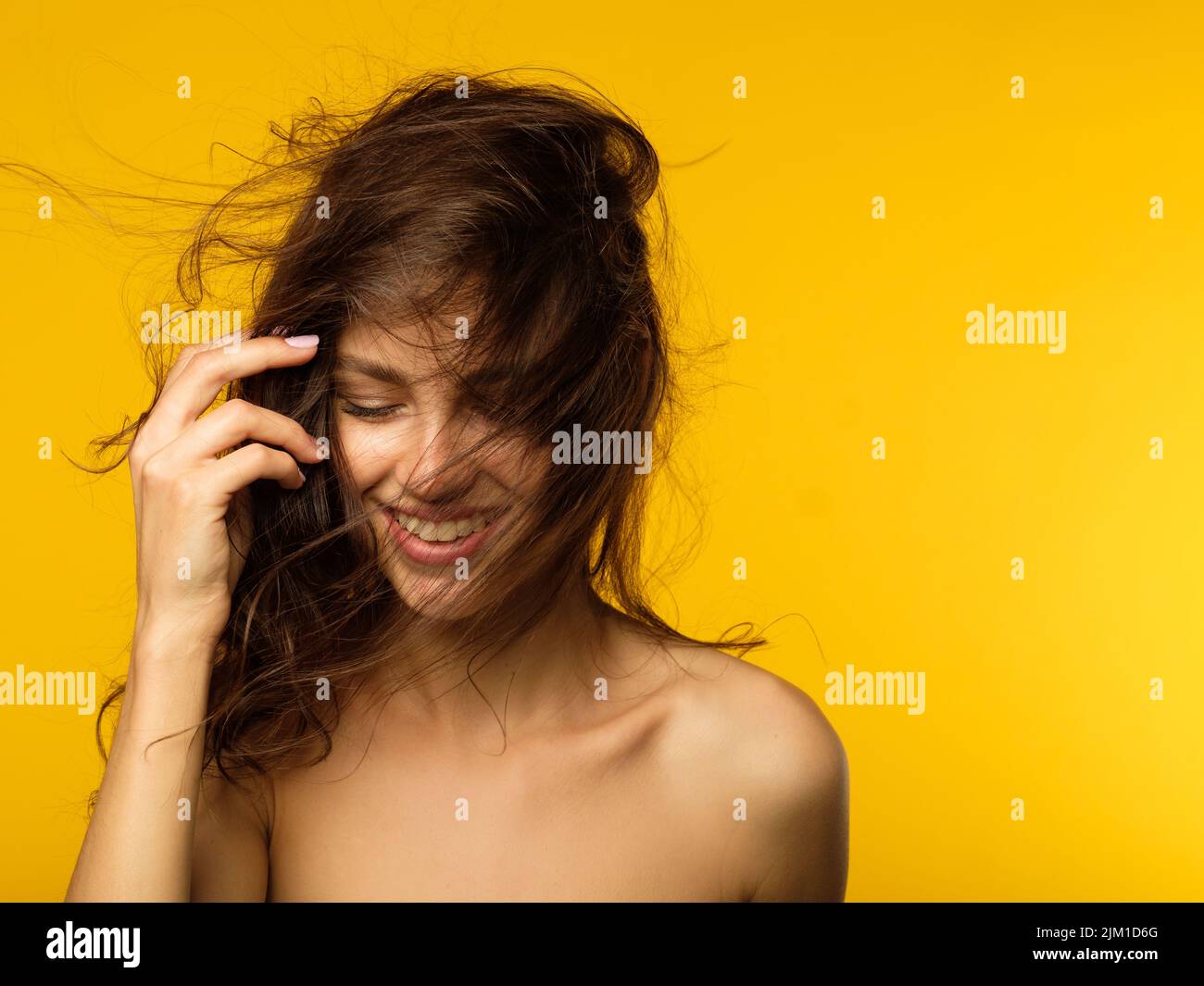 haircare styling brunette girl messy locks beauty Stock Photo - Alamy