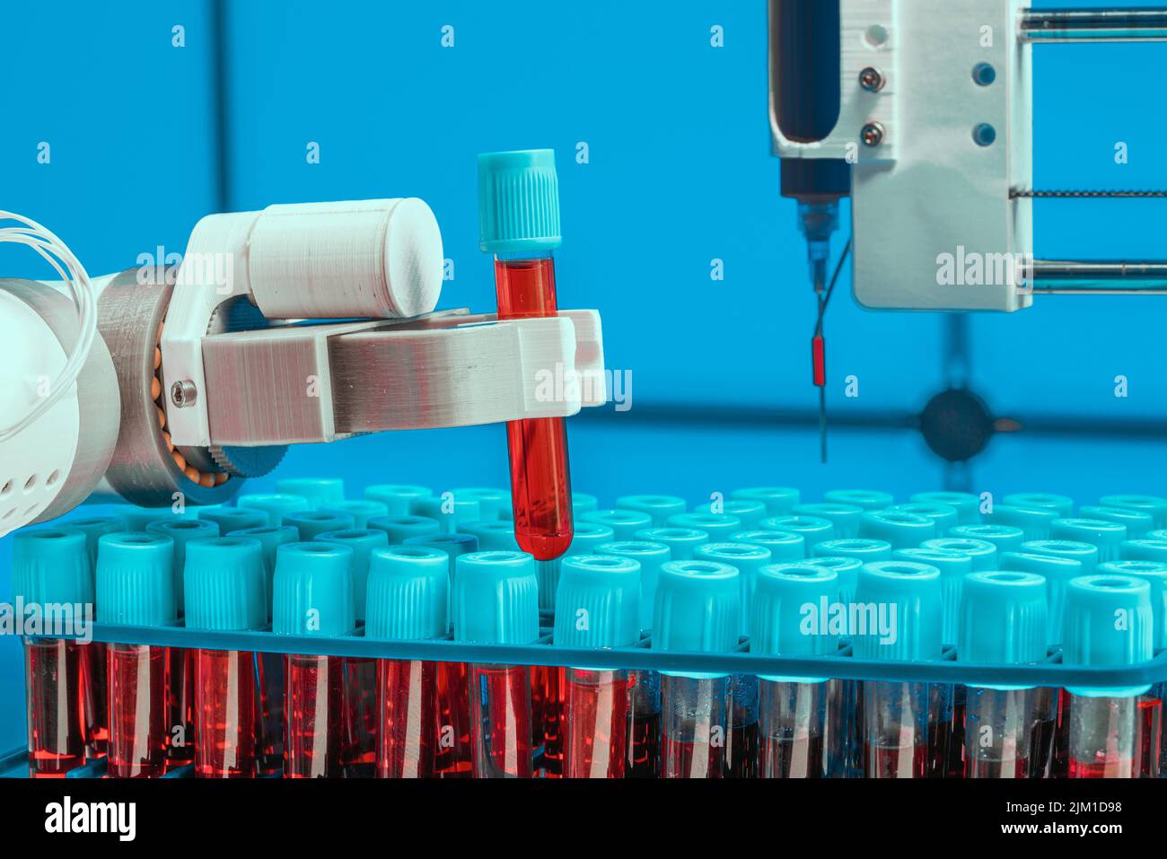 modern genetic laboratory PCR processor and robot with test tube in ...