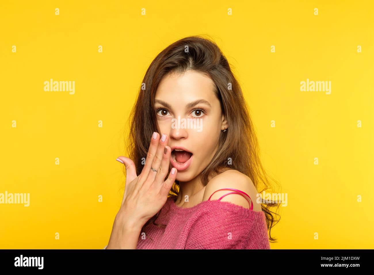 omg shock unbelievable woman cover open mouth Stock Photo - Alamy