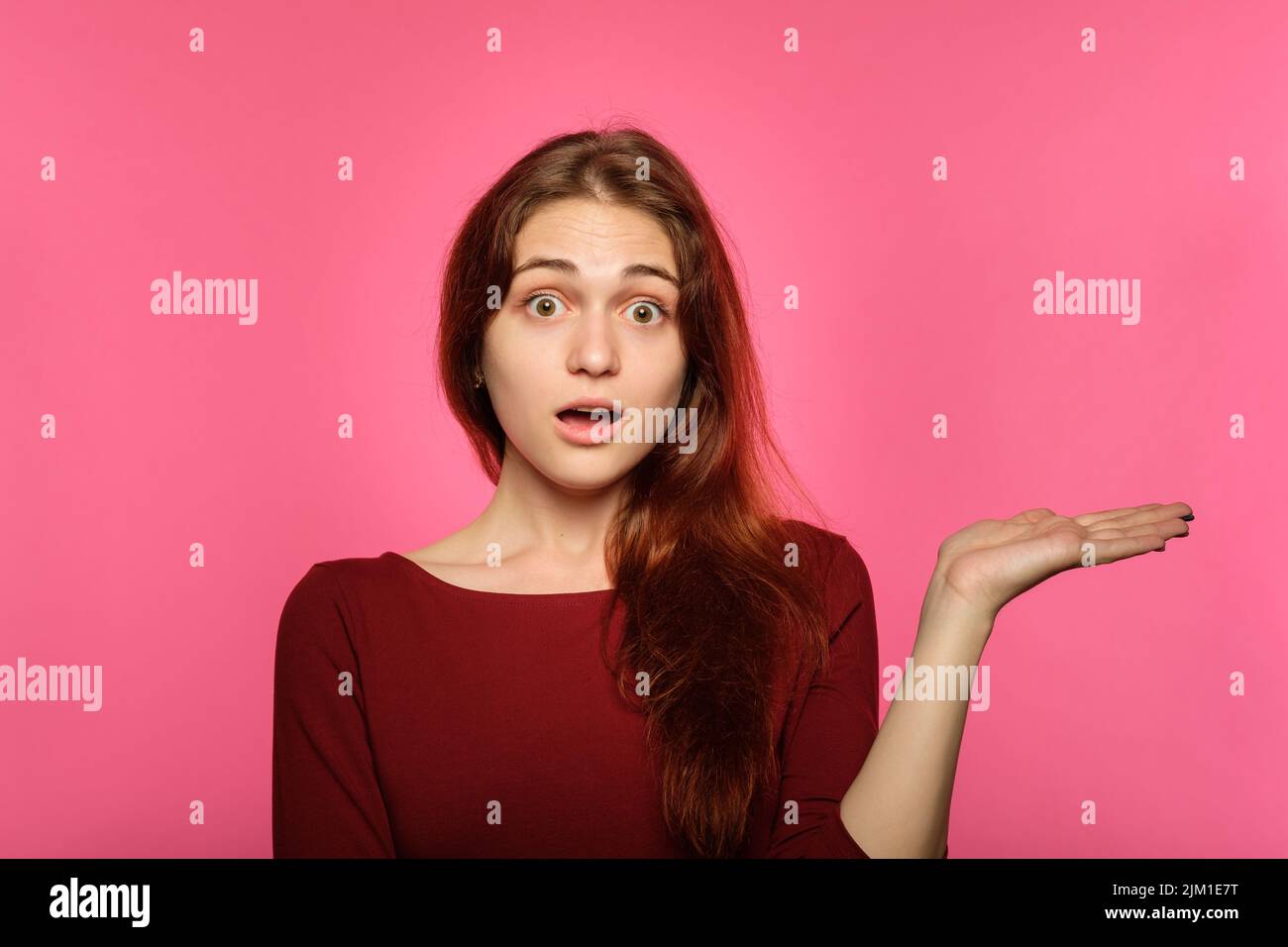 emotion overwhelmed shocked perplexed girl hold Stock Photo - Alamy