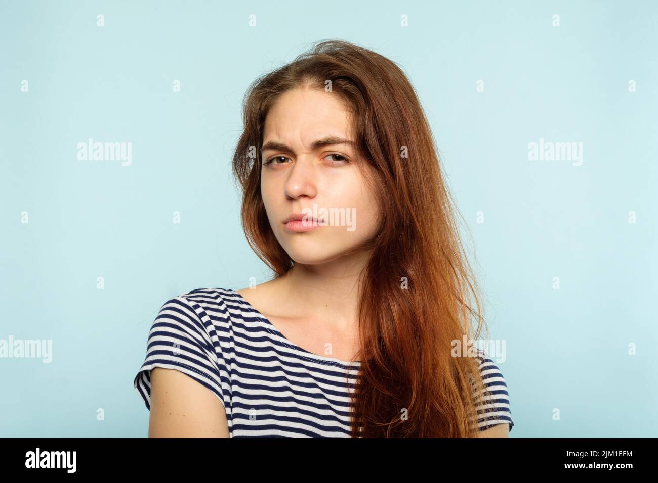 emotion face suspicious thoughtful dubious woman Stock Photo - Alamy
