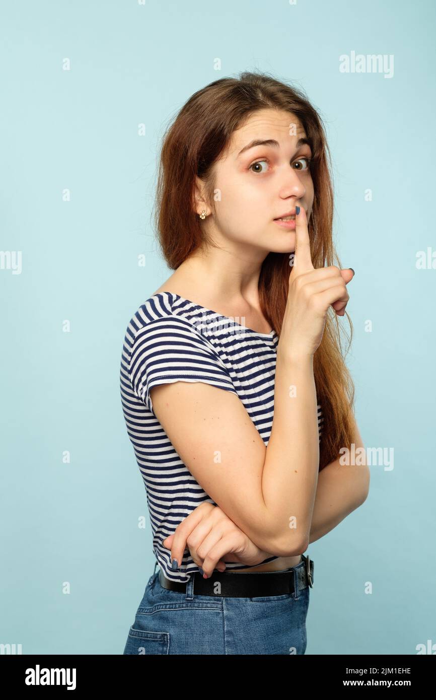 keep secret shush girl portrait finger on lips Stock Photo - Alamy