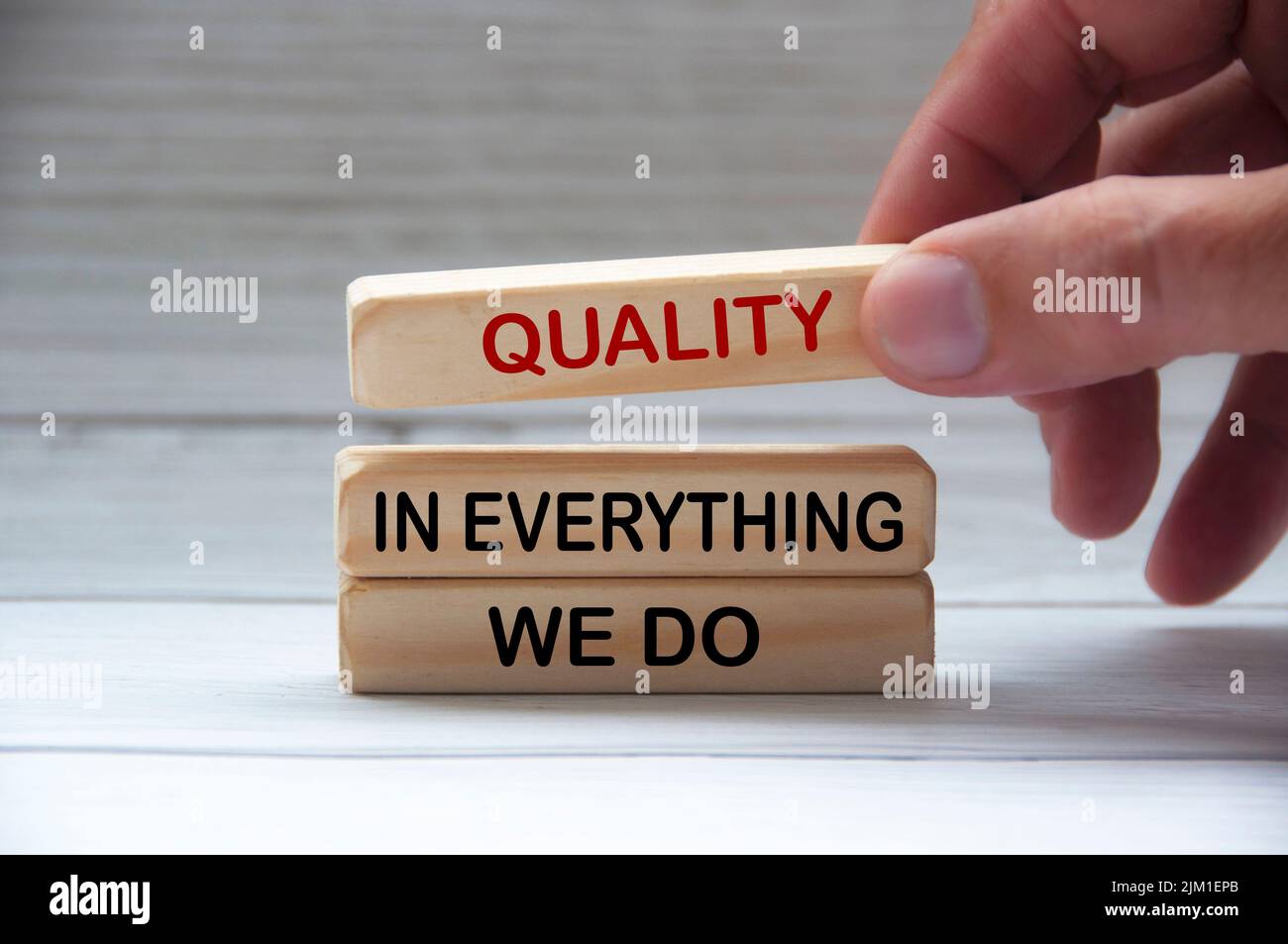 Quality in everything we do text on wooden blocks. Quality control and ...