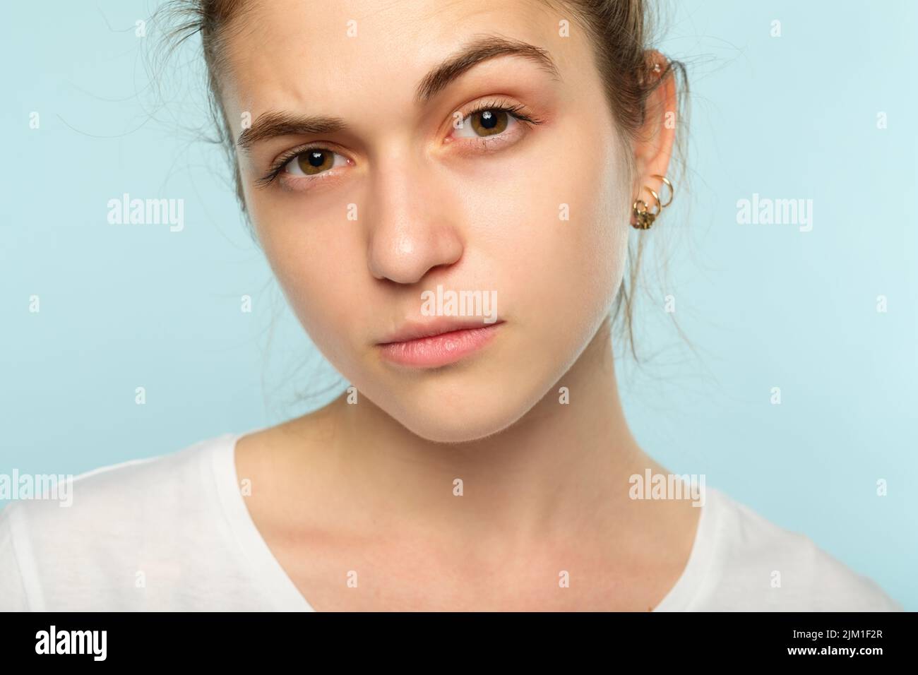 suspicious distrustful dubious woman raise brow Stock Photo - Alamy