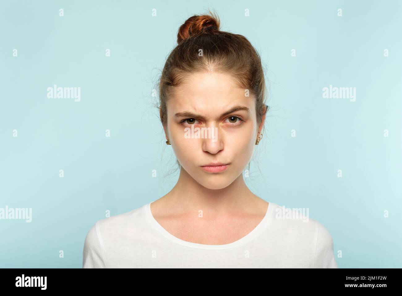 emotion frowning face grumpy pursed lips woman Stock Photo - Alamy