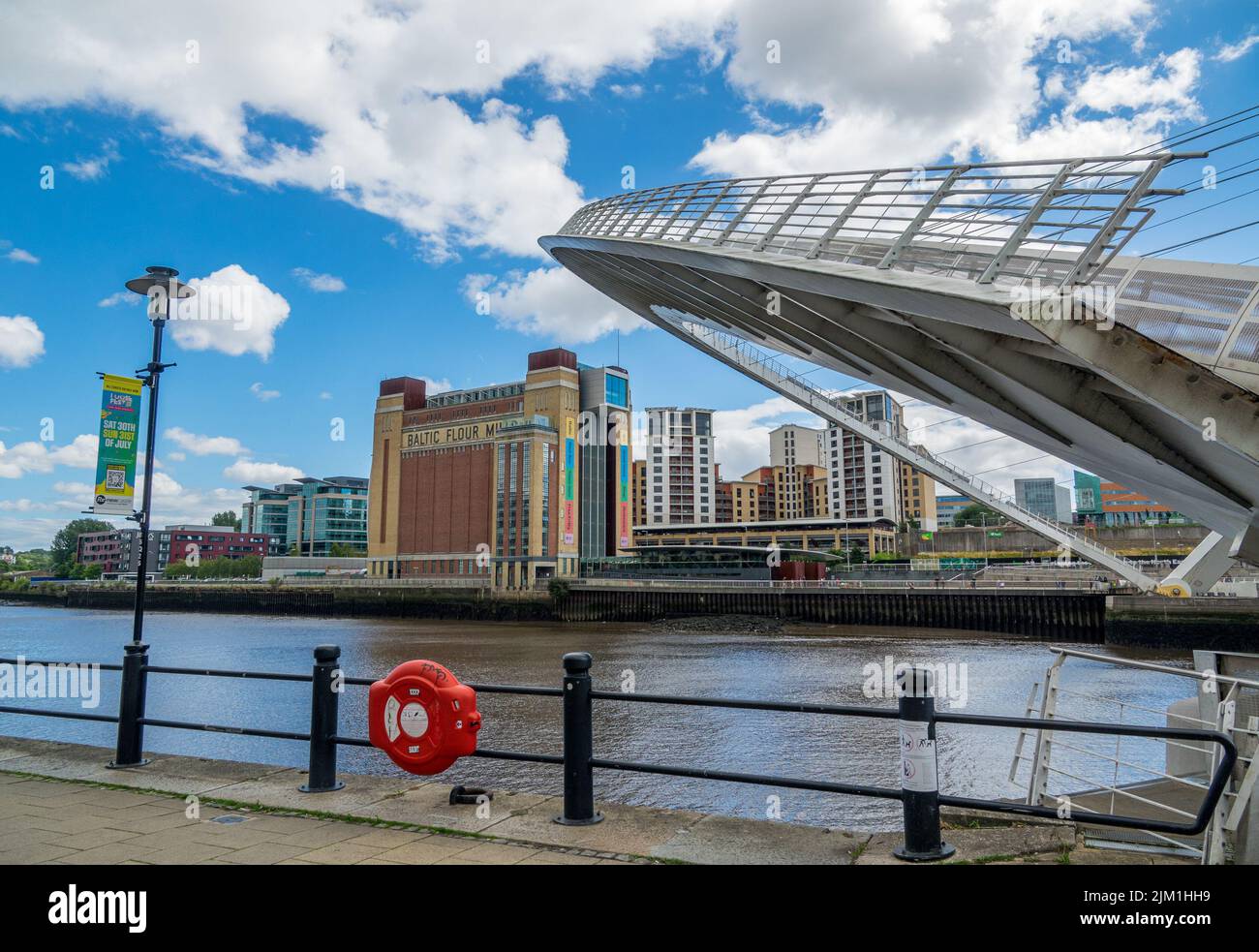 Gateshead Millenium Bridge, Newcastle, being raised over the River Tyne ...