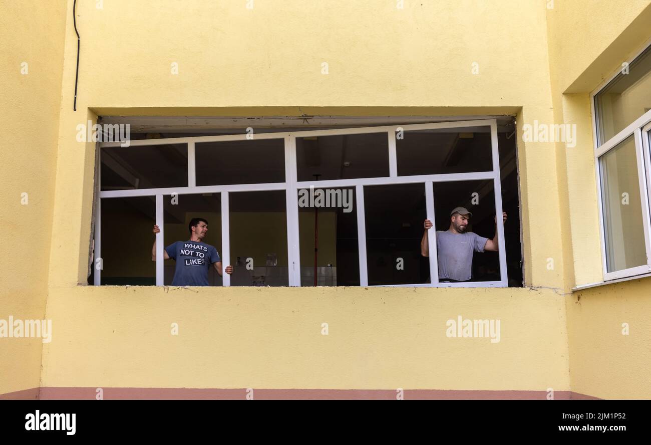 Workers seen installing New windows at School 35 as they prepare for ...