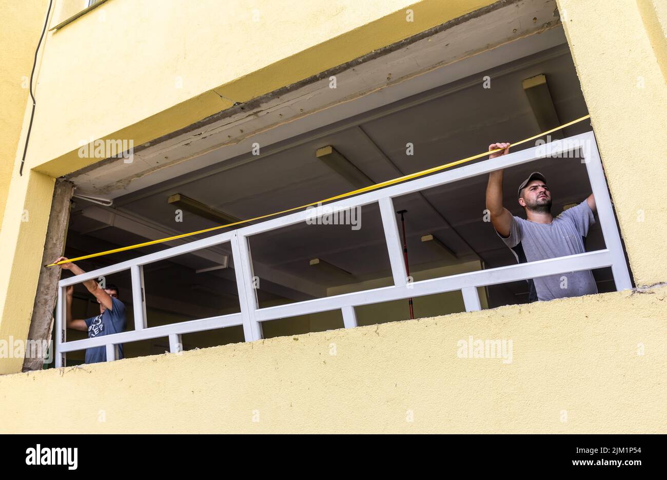 Workers seen installing New windows at School 35 as they prepare for ...