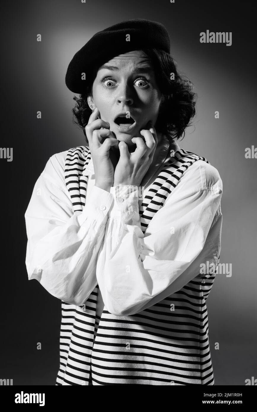 Portrait of beautiful emotive woman in stylish classical clothes ...