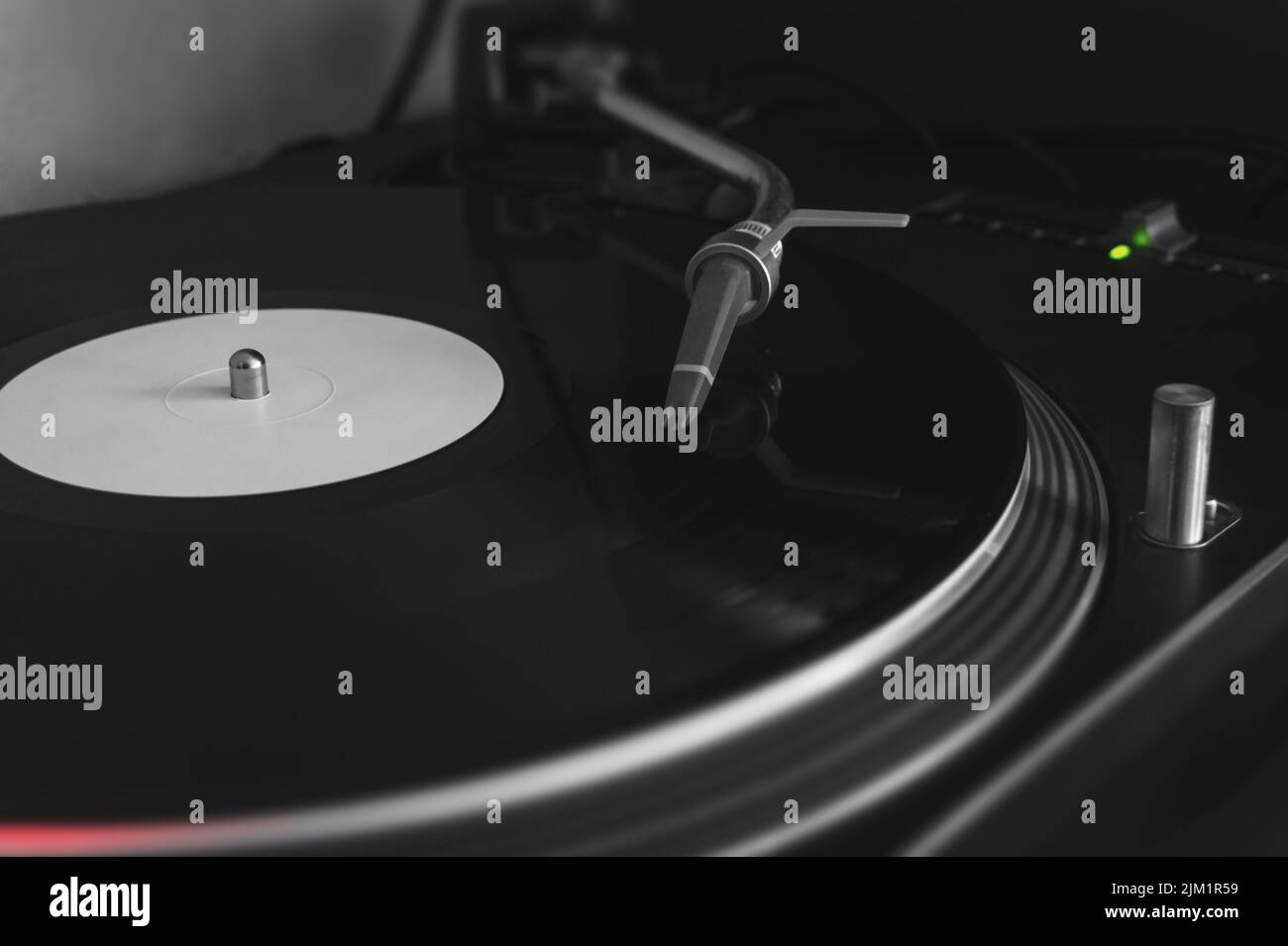 Turntable record player playing blank vinyl with stylus needle, close ...