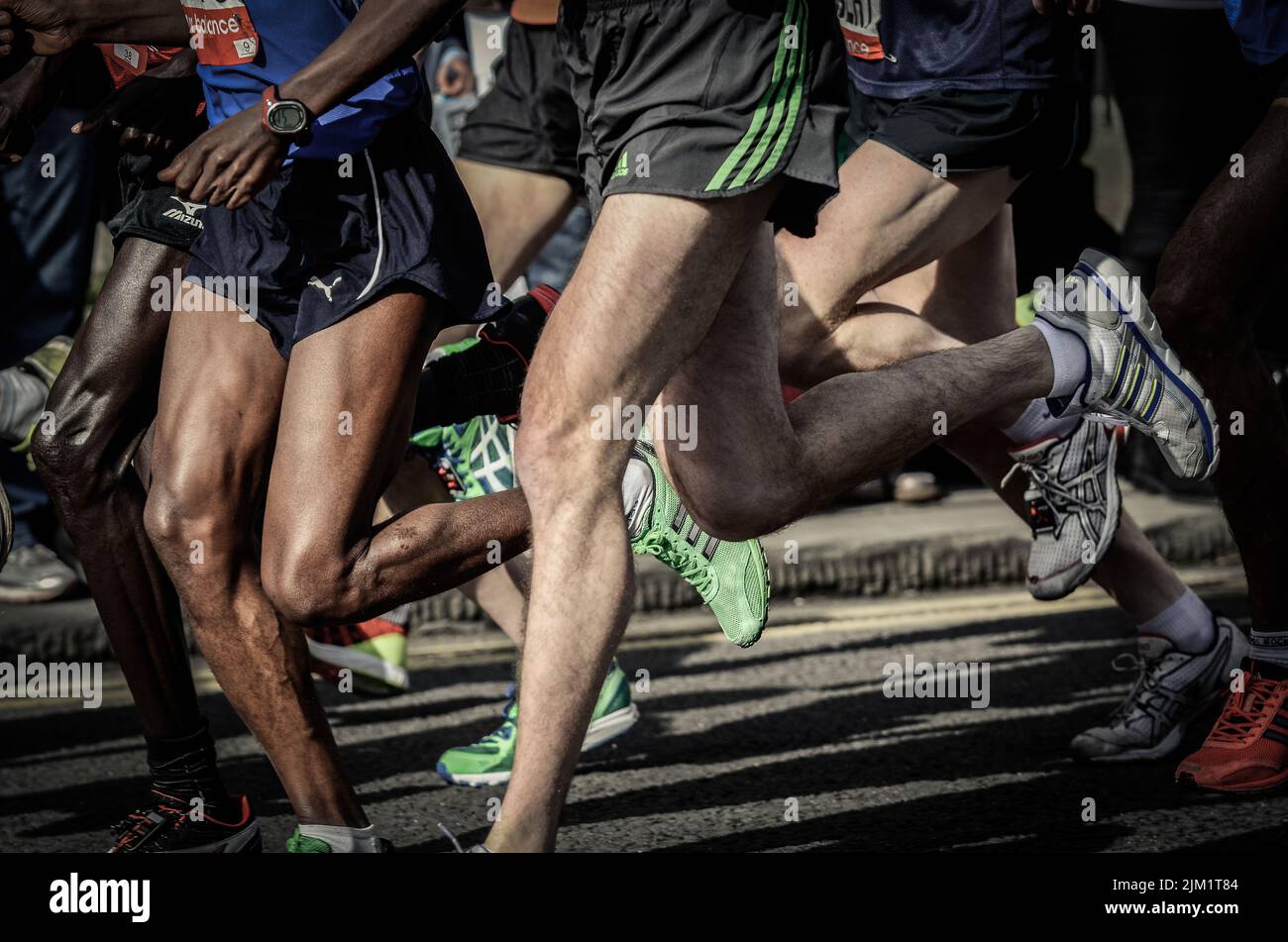 Marathon runners legs Stock Photo - Alamy