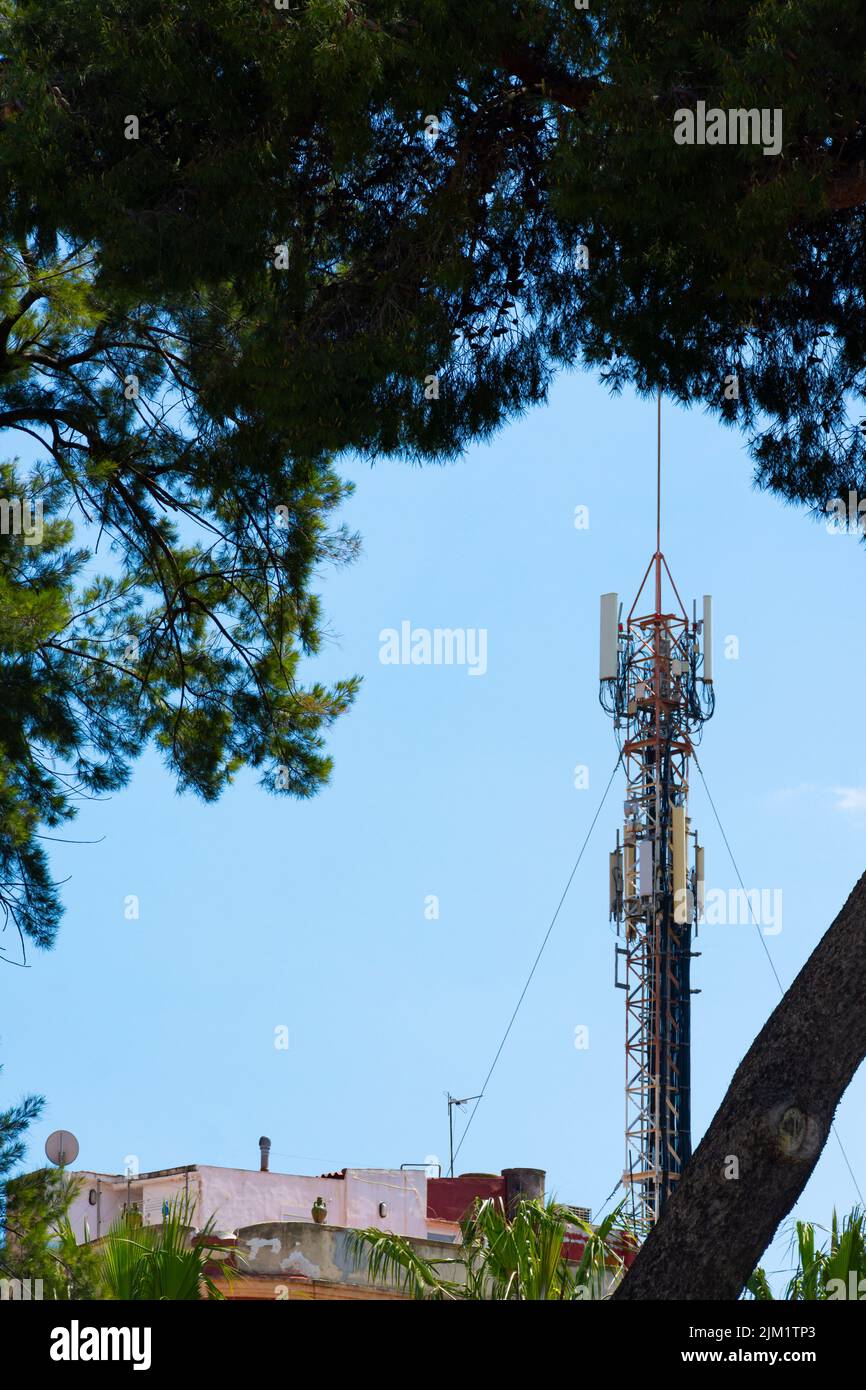Communications tower with telephone and Wi-Fi antennas on some ...