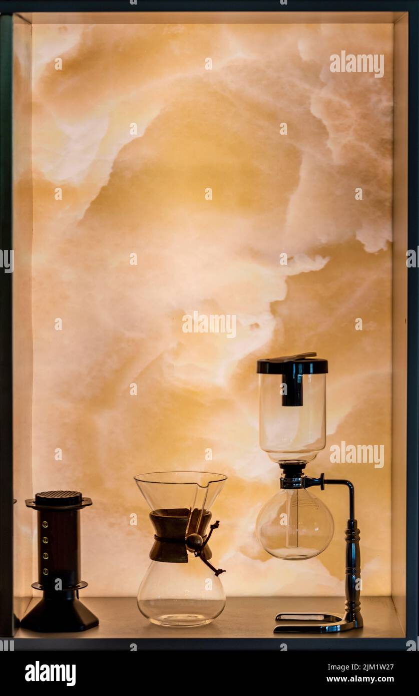 Alternative third generation coffee brewing equipments standing on the ...