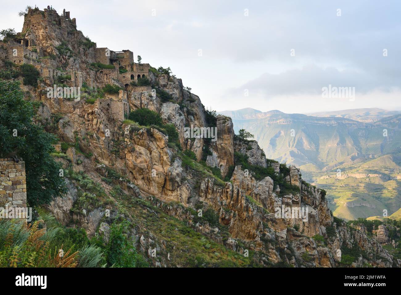 Ancient village Gamsutl on rock on background of mountains. Amazing ...