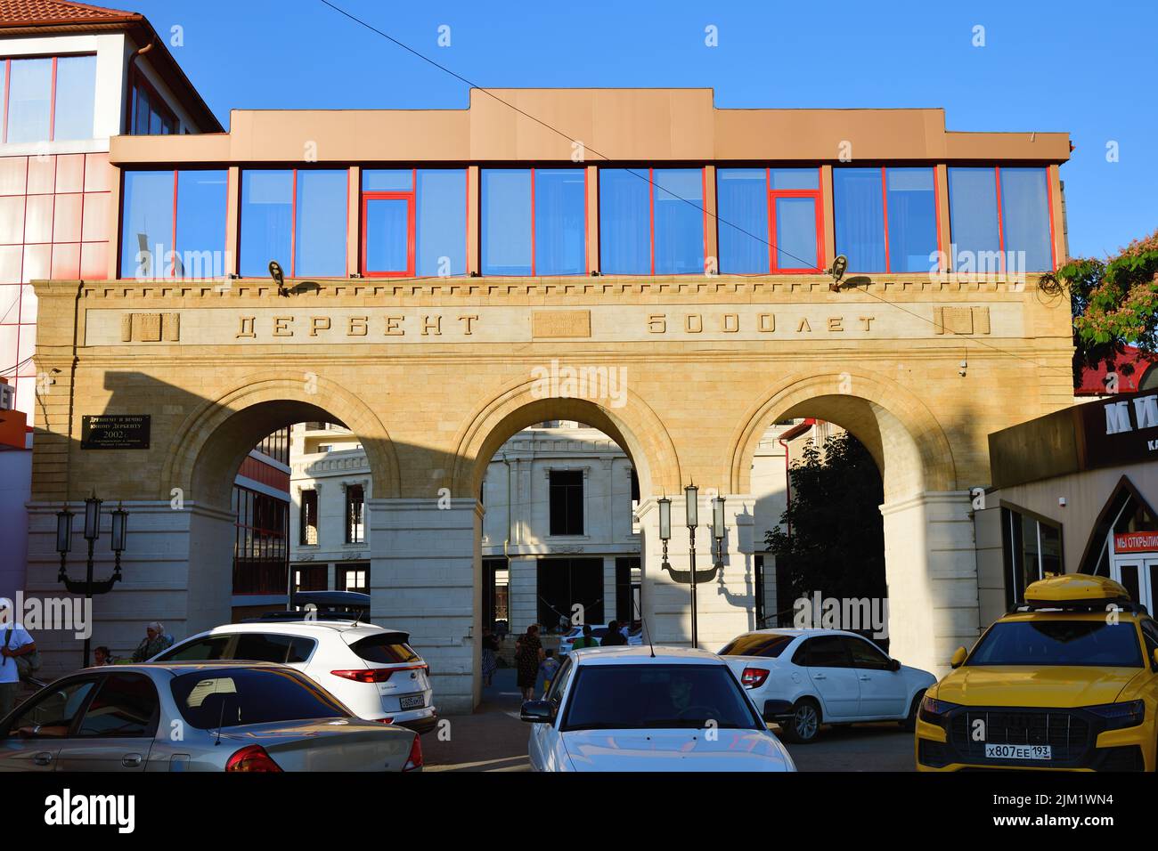 Derbent, Russia - 24 July, 2022: Modern arch in old city. Cyrillic ...