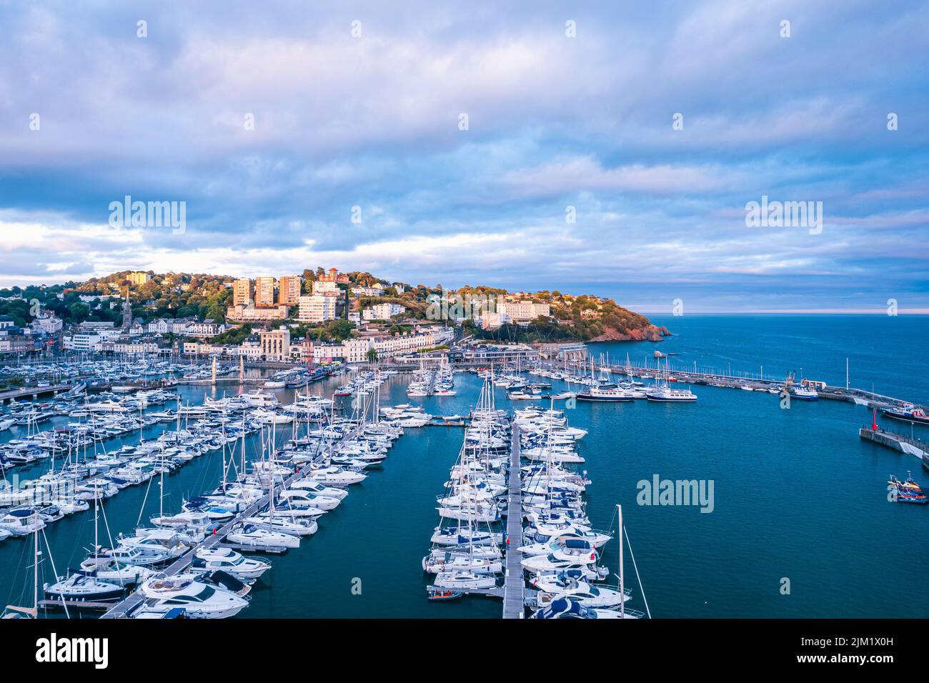 Sunset over Torquay Harbour and Marina, English Riviera from a drone ...