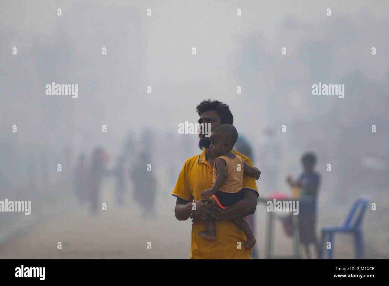 Dhaka, Bangladesh. 03rd Aug, 2022. A man is seen with his daughter in ...