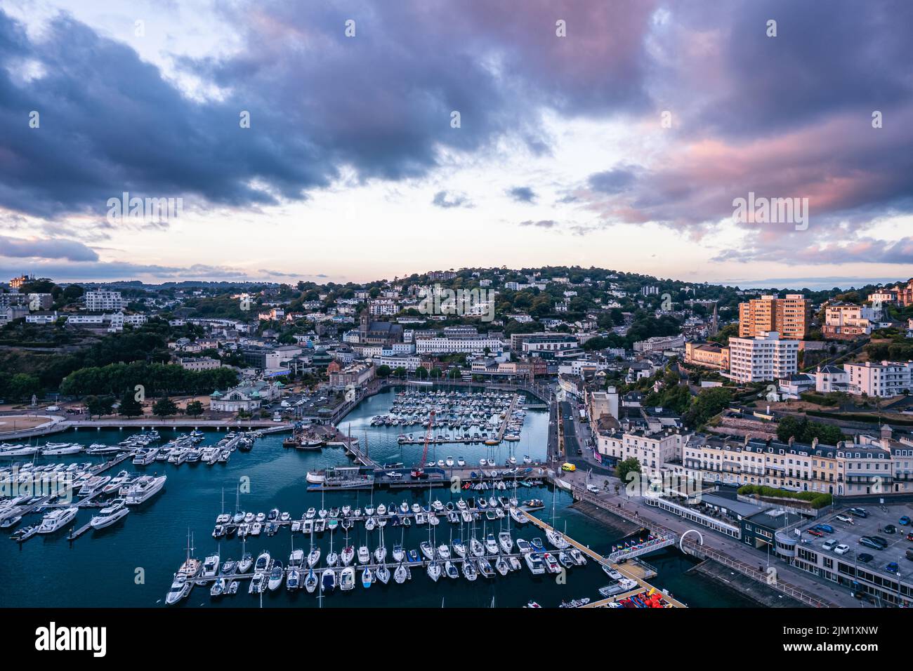 Sunset over Torquay Harbour and Marina, English Riviera from a drone ...