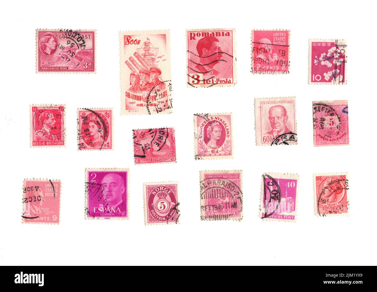 A selection of old pink postage stamps from around the world on a white ...