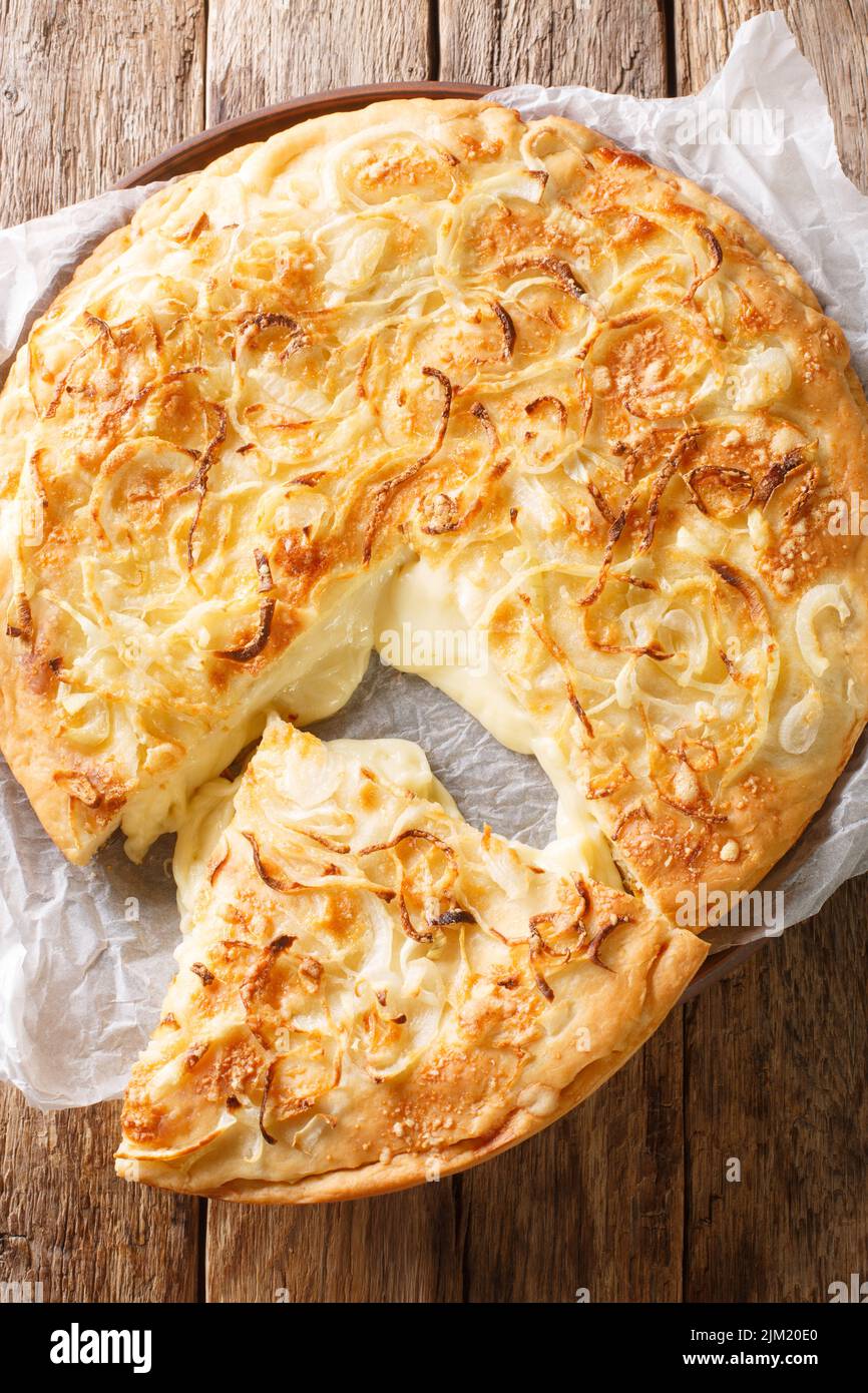 Argentinian Pizza Fugazzeta stuffed with cheese, and topped with the ...