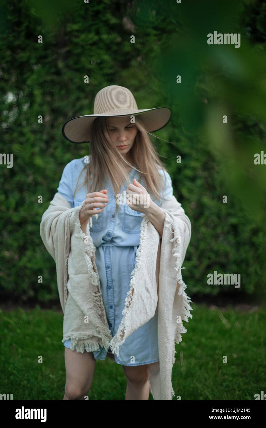 Romantic girl with hat on picnic in park Stock Photo - Alamy