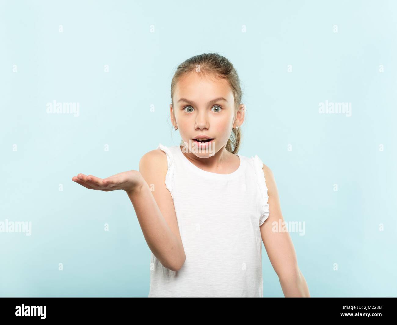 amazed girl holding hand empty space advertising Stock Photo - Alamy