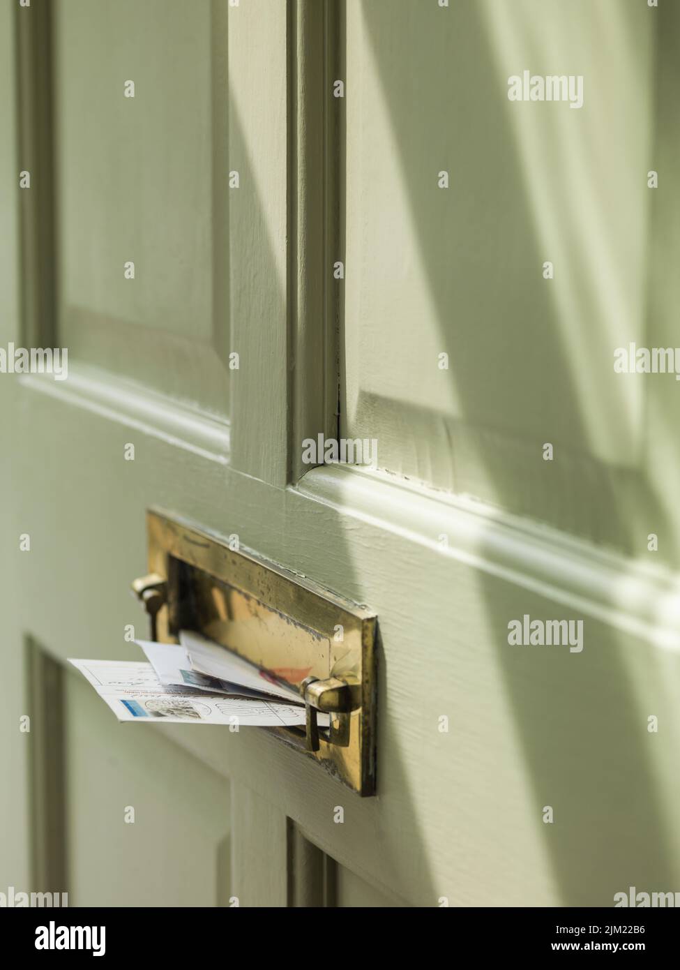 Letters sticking out of door Stock Photo - Alamy