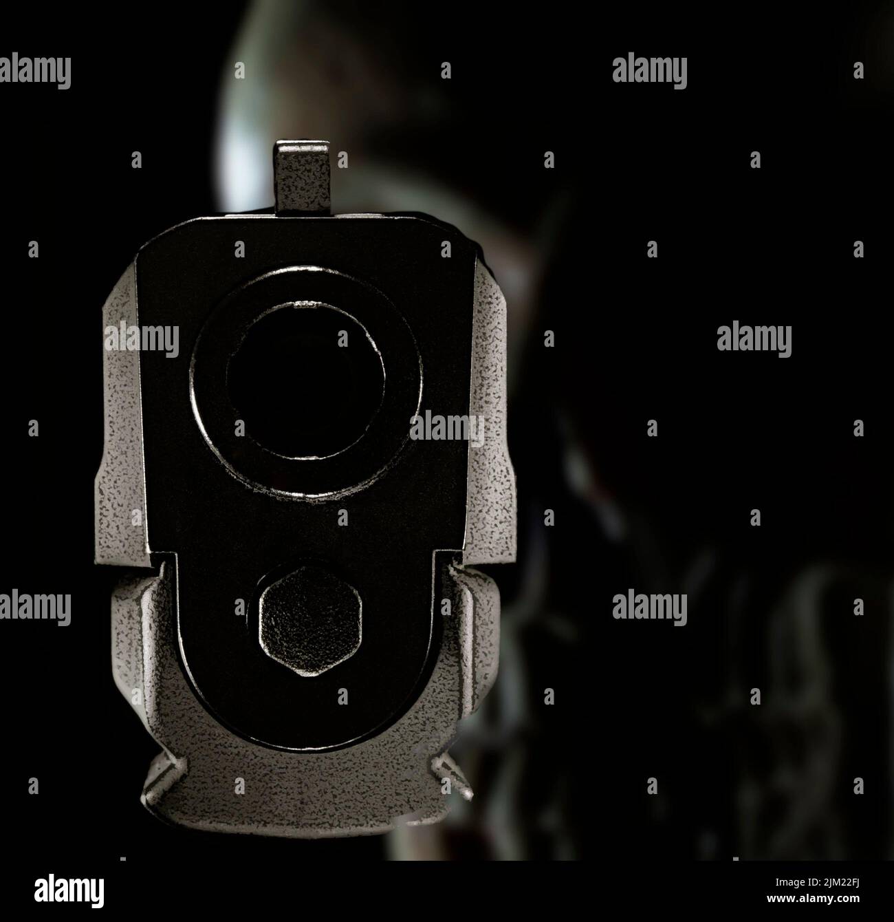 3-D rendering of a ghost gun seen from the front with a skull behind ...