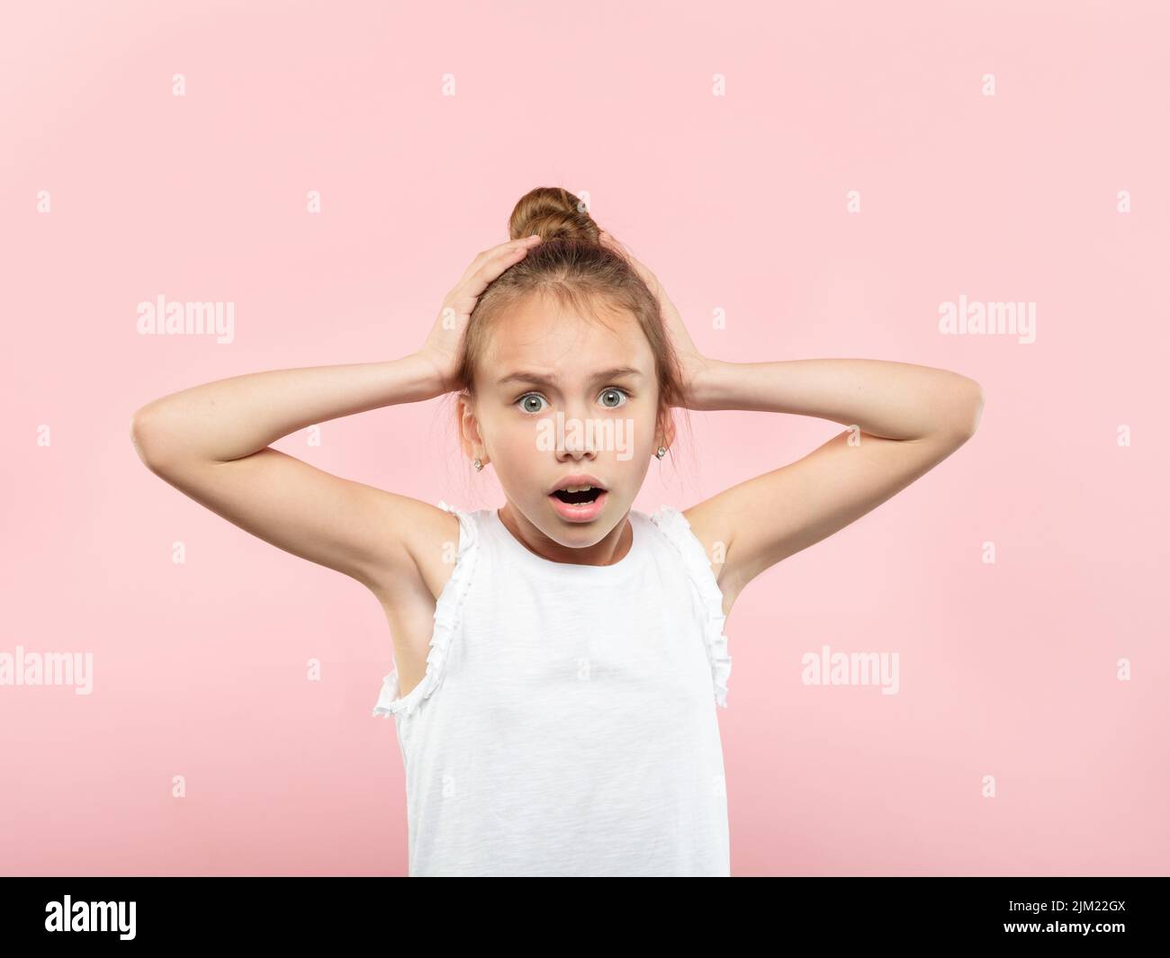 omg shock amazement child clutch head hands Stock Photo - Alamy