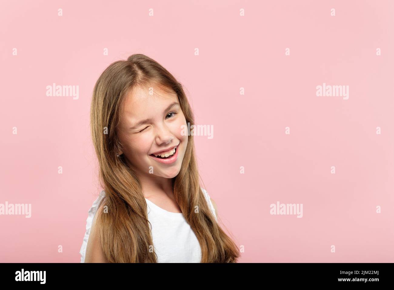 emotion face smiling cute adolescent girl winking Stock Photo - Alamy