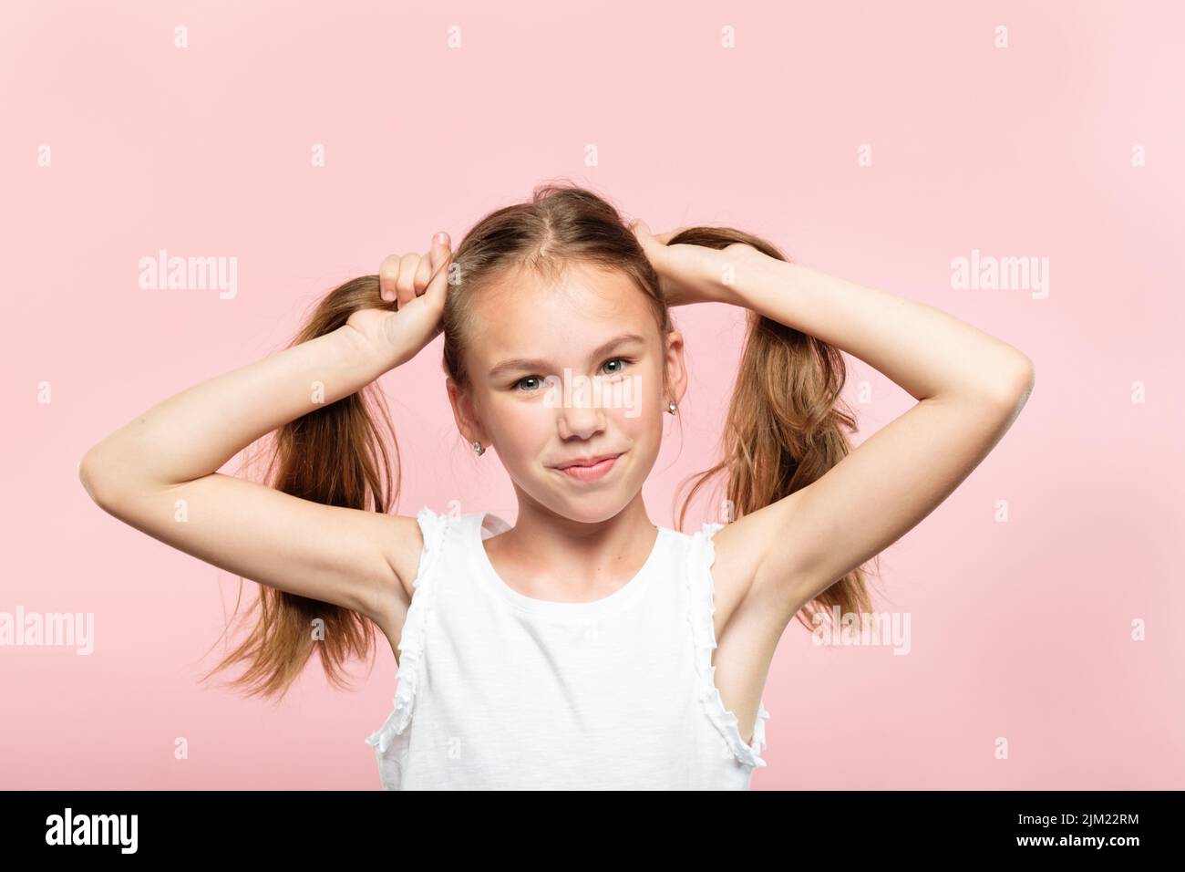 joyful adolescent girl pig tails hair lifestyle Stock Photo - Alamy