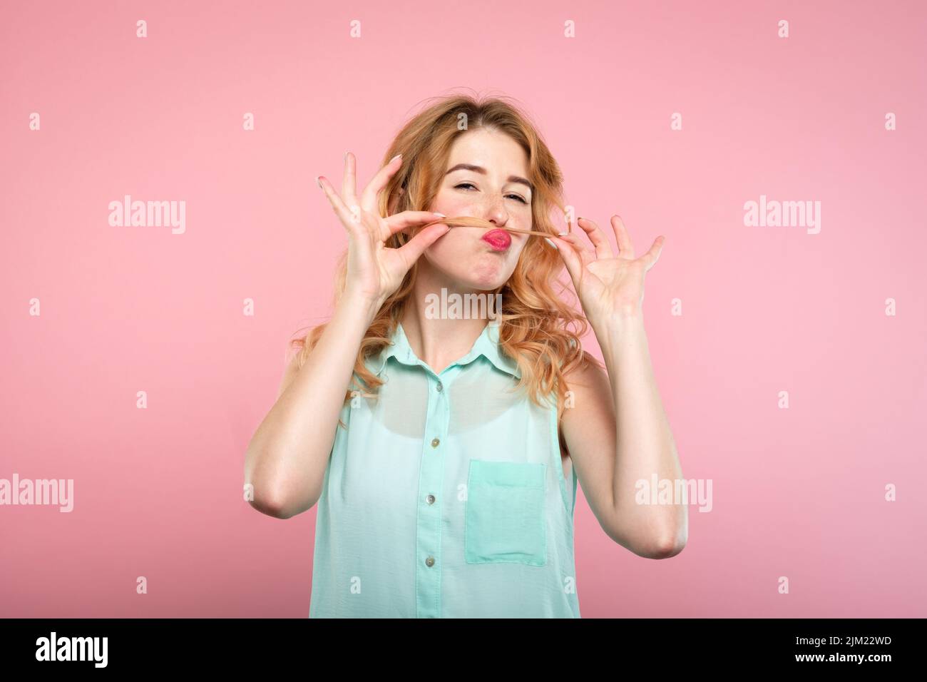 funny playful carefree girl fooling hair mustache Stock Photo - Alamy