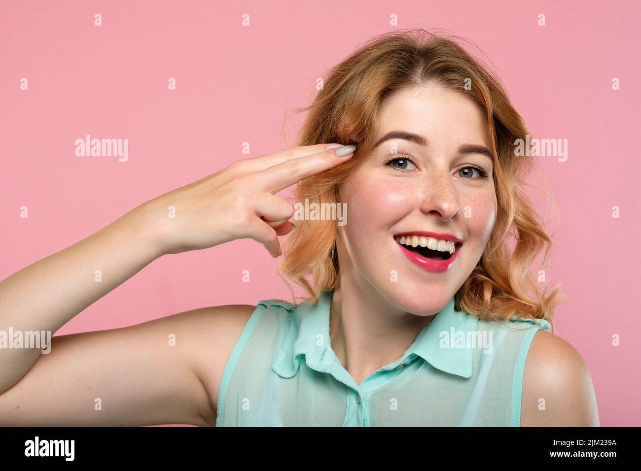 happy woman press finger gun head conflict emotion Stock Photo - Alamy