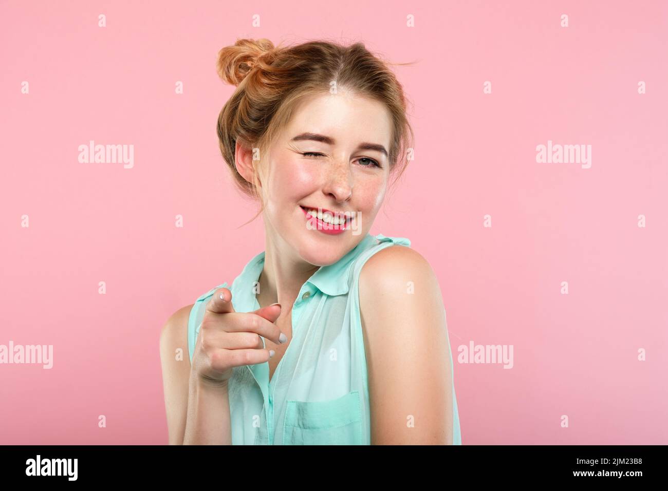 flirty coquettish woman smiling winking expression Stock Photo - Alamy