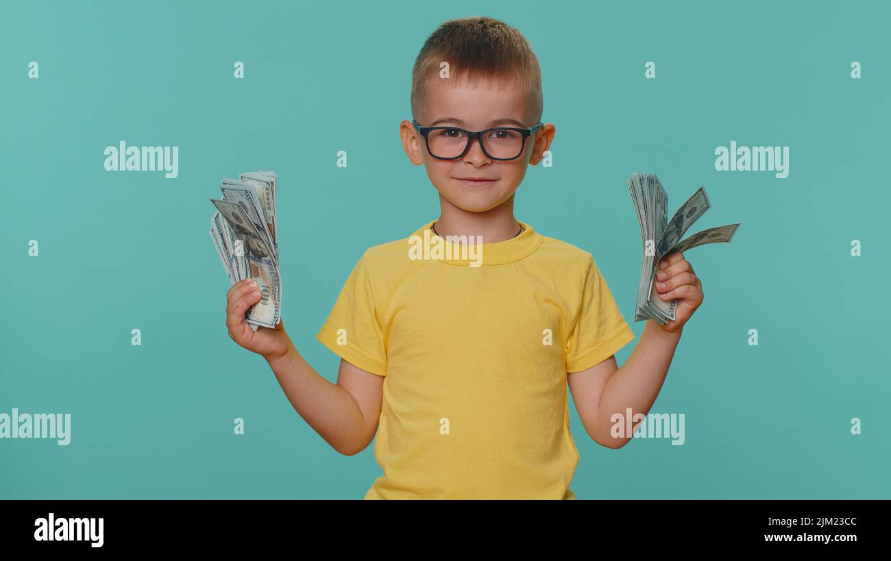 Little toddler children boy holding fan of cash money dollar banknotes ...