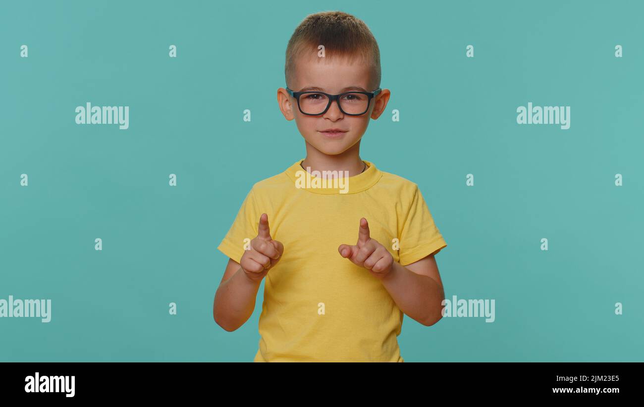 Quarrel. Displeased little toddler children boy shakes finger and ...