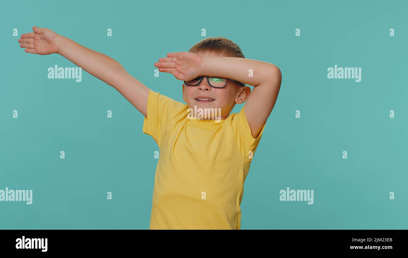 Trendy cheerful positive little toddler children boy having fun dancing ...