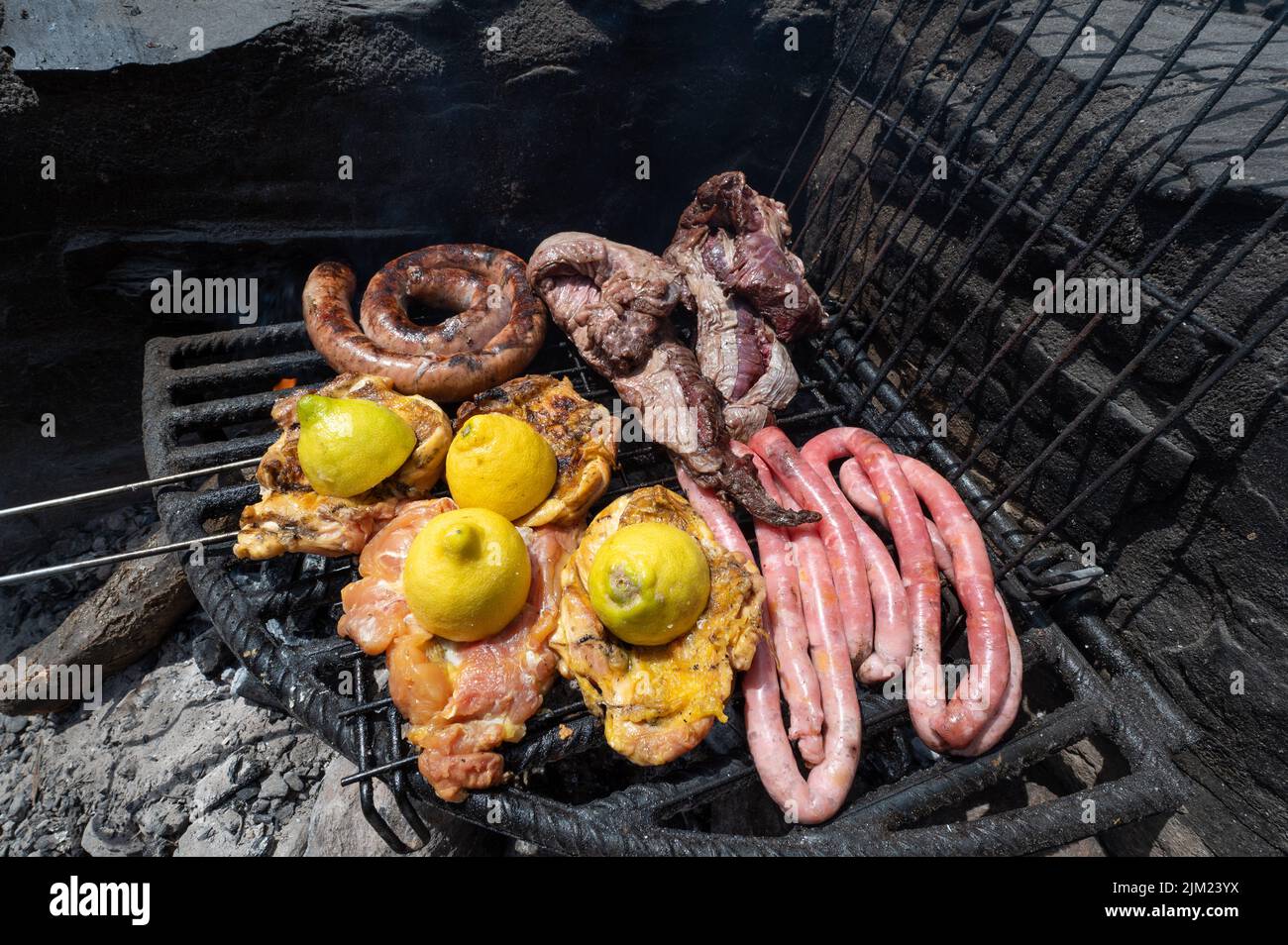 Typical Uruguayan and Argentine Asado Cooked on fire. Entrana and Vacio ...