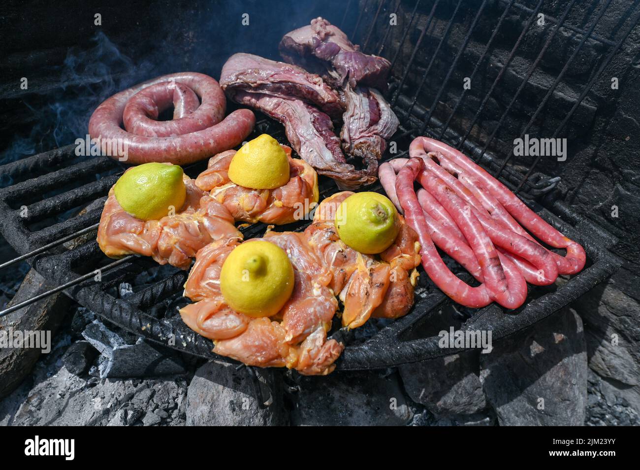 Typical Uruguayan and Argentine Asado Cooked on fire. Entrana and Vacio ...