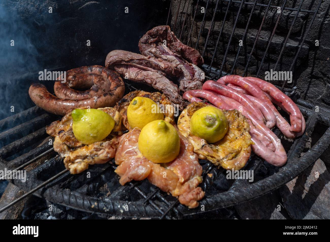 Typical Uruguayan and Argentine Asado Cooked on fire. Entrana and Vacio ...