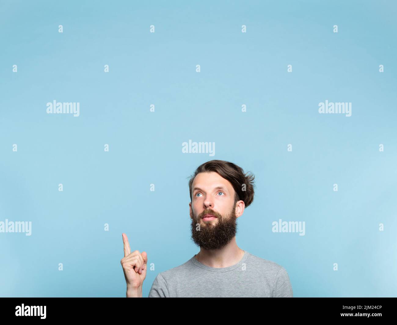 man point up above hipster bearded advertisement Stock Photo - Alamy