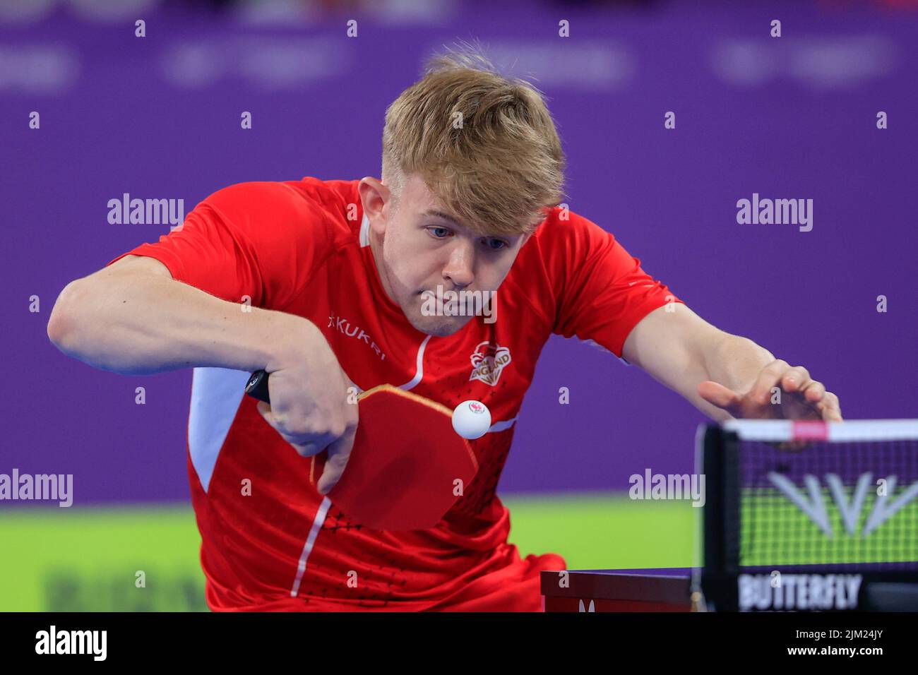 Tom Jarvis of England hits a backhand return in the game against ...