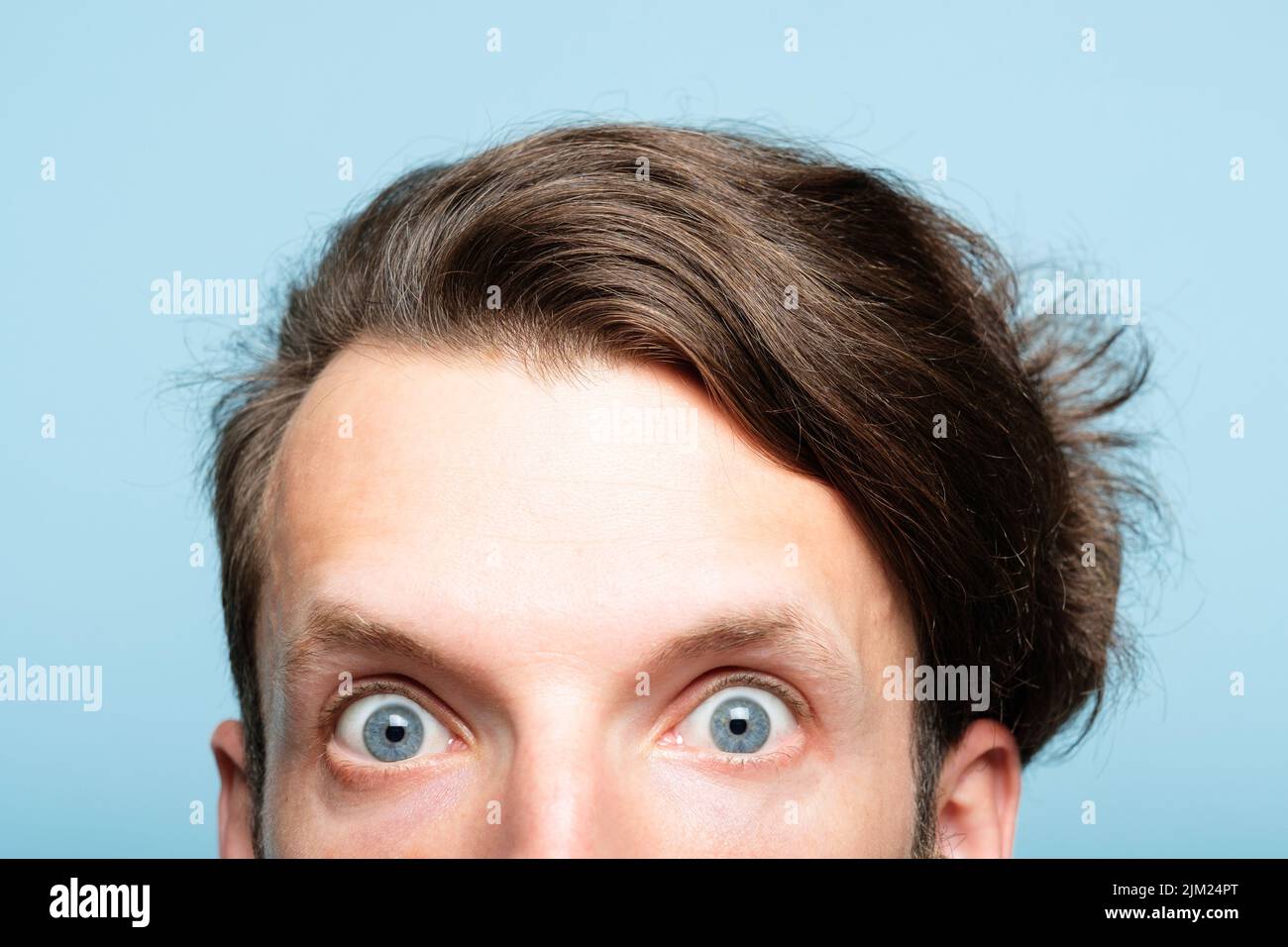 startled eccentric man head peek out crazy look Stock Photo - Alamy