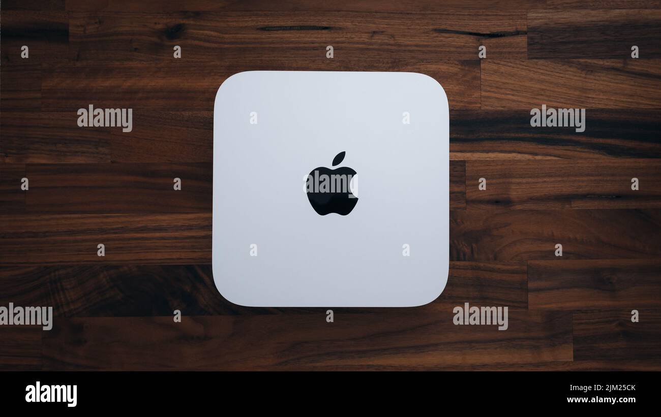 LONDON - AUGUST 3, 2022: Apple Mac Mini computer top view on wood ...